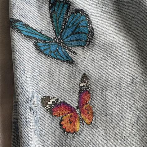 Amiri Broken Butterfly Flared Stretch Jeans In Depop