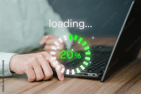 Foto Stock Man Using Laptop For Download Software And Waiting To Loading Digital Business Data