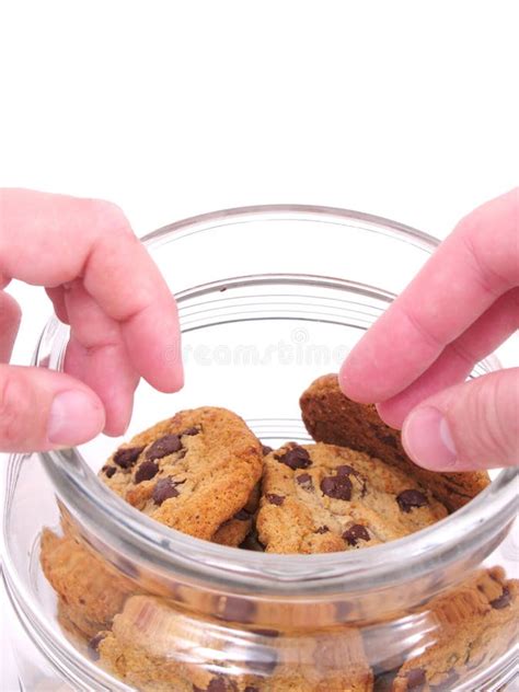 A Person Getting A Cookie From Jar Stock Photo Image Of Adult Chip