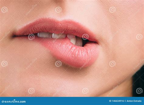 Close Up Of Beautiful Women`s Lips Covered With Lipstick Bite Lower Lip White Teeth Move Cut