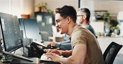 Computer Typing And Web Development With Happy Man In Creative Workplace For Coding Or Design