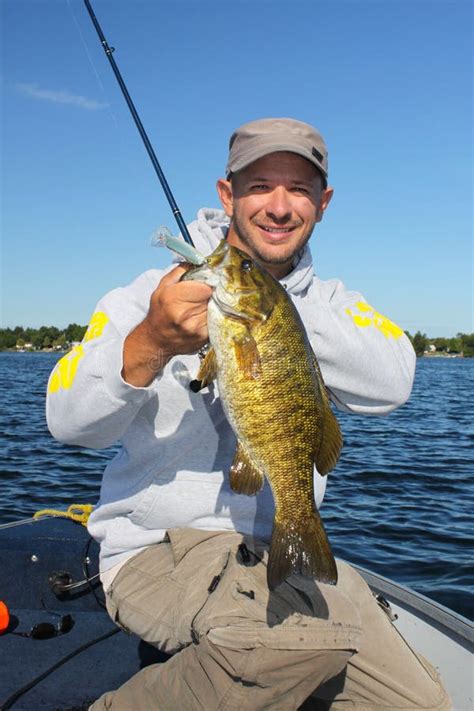 Man Fishing Holding Smallmouth Bass Stock Image Image Of Outdoor