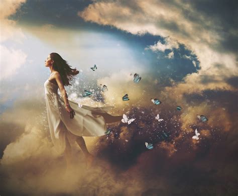 Фото Девушка в белом платье идет по небу за ней летит множество голубых и белых бабочек