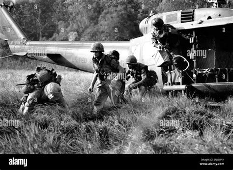 Troops Of The Us 196th Light Infantry Brigade Leap From A Helicopter