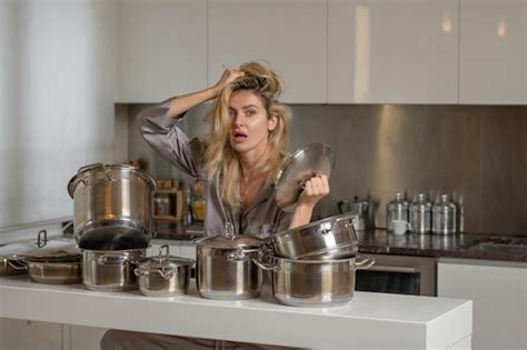Premium Photo Sad Woman Preparing Food In The Kitchen Woman Wearing