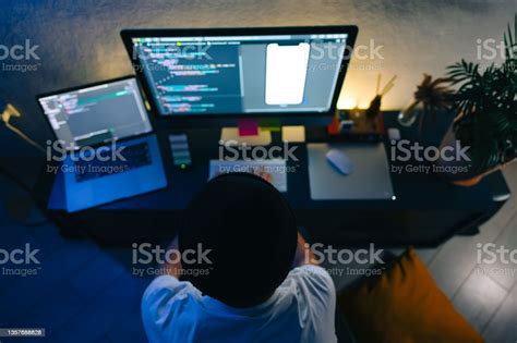 Young Man Mobile Developer Writes Program Code On A Computer Programmer