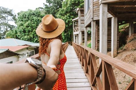 Premium Photo Pov Of Couple Enjoying A Walk On A Wooden Bridge Travel