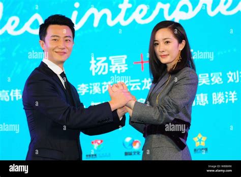 Chinese Actress Yang Mi Right And Actor Huang Xuan Pose During A