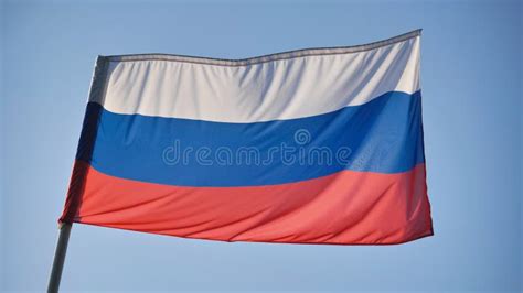 Russian Tricolor Flag With White Blue And Red Stripes Flapping In The