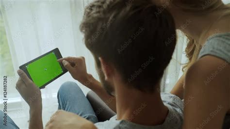 Man And His Girlfriend Using Tablet Green Screen Great For Mock Up Most Popular Gestures Used
