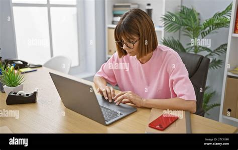 Young Beautiful Serious Hispanic Woman Boss A Successful Business