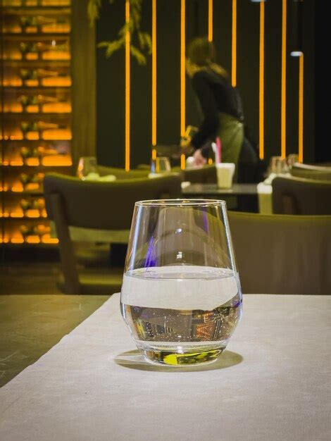 Premium Photo A Glass Glass With Clean Drinking Water Stands On A