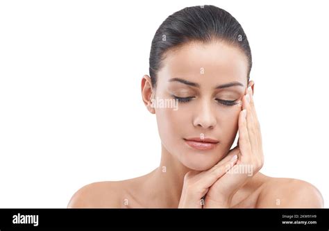 Her Skin Is Silky Smooth A Beautiful Young Woman Rubbing Her Face With