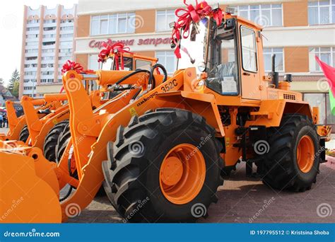 Tractor With A Bucket For Digging Soil Bulldozer And Grader Editorial