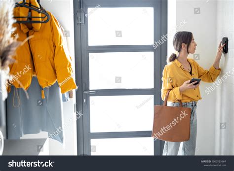 Woman Enters Code On Alarm Keyboard Stock Photo Shutterstock