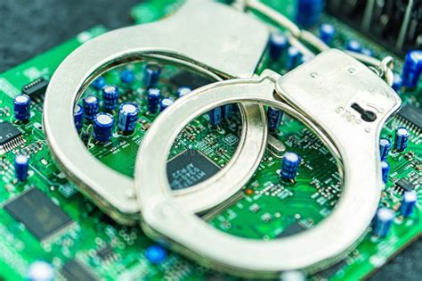 Cybercrime The Concept Of Cybercrime Handcuffs Lie On A Computer Board Stock Image Image Of