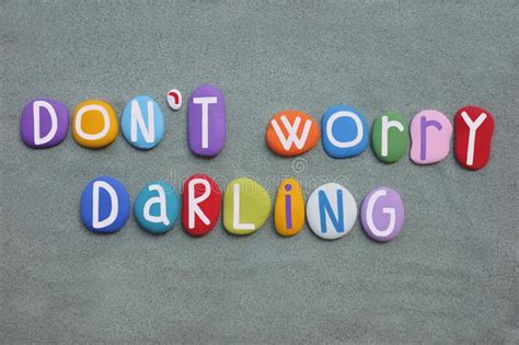 Do Not Worry Darling Creative Text Composed With Multi Colored Stone Letters Over Green Sand