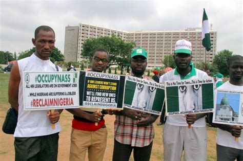 Photos Nigerians Stage Protest In Abuja Demands Sarakis Resignation