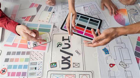 Ux Design And Collaboration Creative Professionals Brainstorming Uiux Concepts On A Design