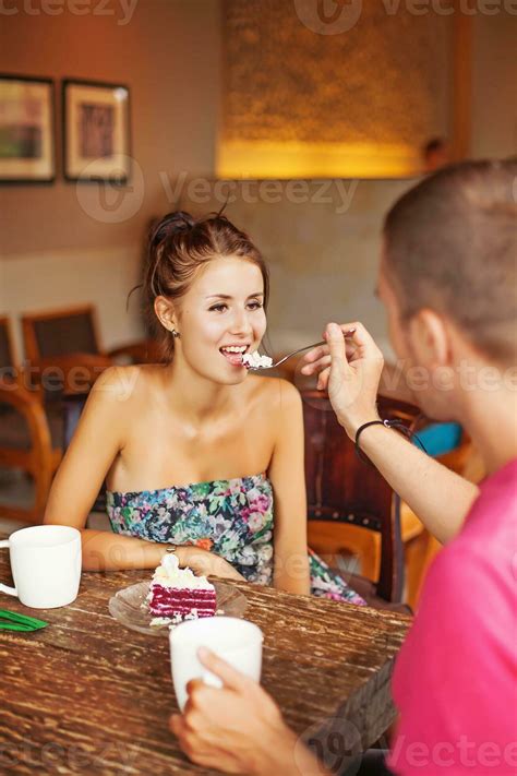 Couple Feeding Each Other With The Cake In Restaurant 24754214 Stock