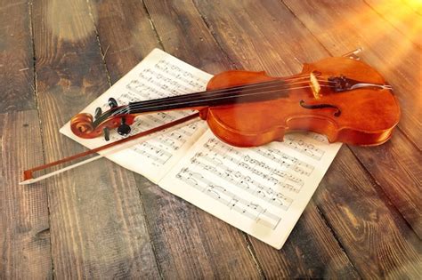 Premium Photo Violin And Musical Notes On Desk