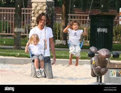 Chris Cornell His Son Christopher And Daughter Toni Playing On The Swings As The Musician Spent