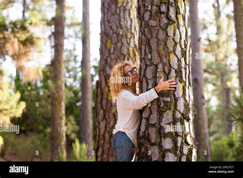 Happy Beautiful Woman Embrace Big Tree Trunk Enjoying Outdoors Nature Leisure Activity Save