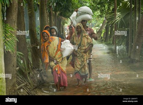 Women Returning After Collecting Relief Which Is Distributed Due To