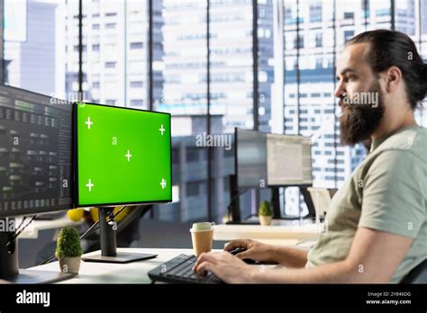 Technician Conducting Code Review On Isolated Screen Computer To Fix Bugs Identifying