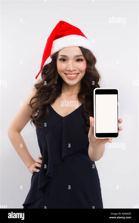 Smiling Christmas Woman Showing Blank Smartphone Screen Isolated On A