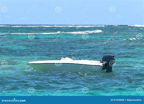 Small Motor Boat Sailing On The Big Turquoise Ocean With Waves Stock
