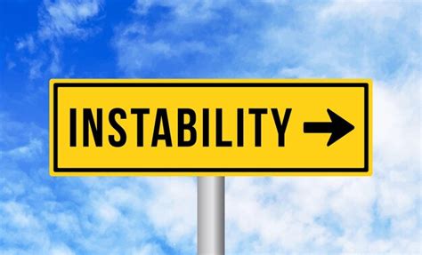 Premium Photo Instability Road Sign On Blue Sky Background