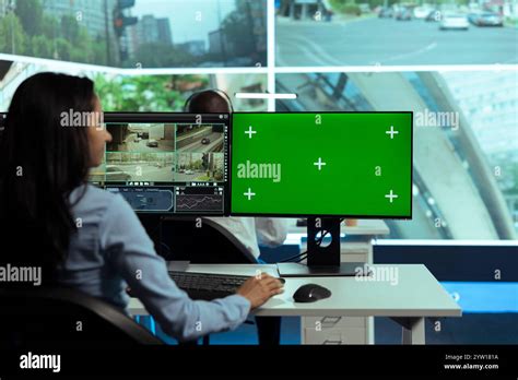 Indian Employee Works With Isolated Mockup Screen And Monitoring Traffic Using City