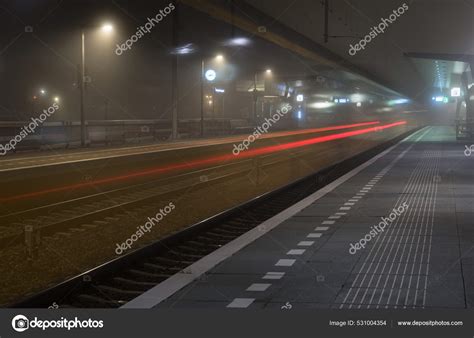 Train Passing Empty Platform Railroad Station Foggy Evening Groningen