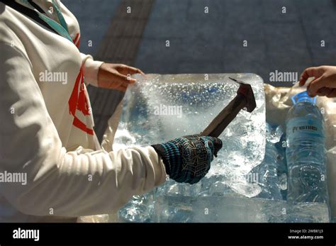 Woman Breaking Block Of Ice With An Axe Siem Reap Cambodia Stock Photo Alamy