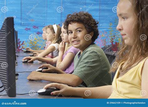 Boy With Classmates In Computer Lab Stock Image Image Of Educational