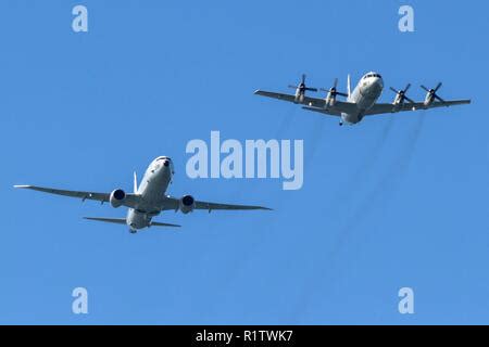 A Lockheed P 3 Orion Flies In Formation With Its Succesor The Boeing P