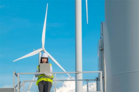Premium Photo Women Engineer Working And Holding The Report At Wind Turbine Farm Power