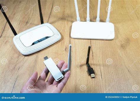 Man Choose Of Different Types Of Wi Fi Routers Modern And Old Technology Wireless Ethernet