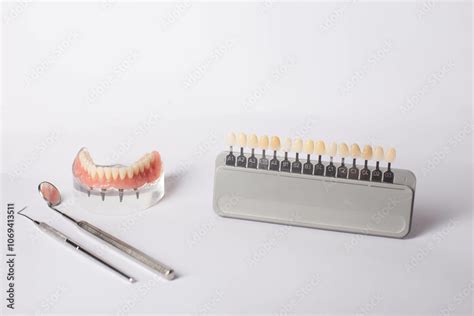 Render Of Mandibular Prosthesis All On 4 System Supported By Implants Over White Background
