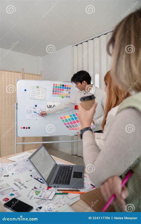 Creative Ux Developer And Ui Designer Brainstorming Session With Color Palettes And Wireframes