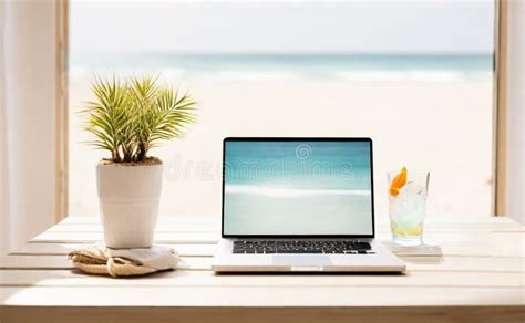 A Serene Remote Work Setup With An Open Laptop On A Wooden Desk A