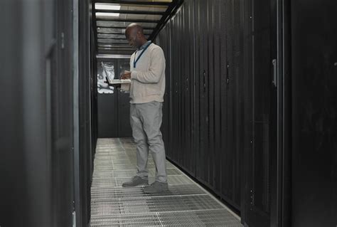 Premium Photo Server Room Data Center Or It Black Man With Laptop For