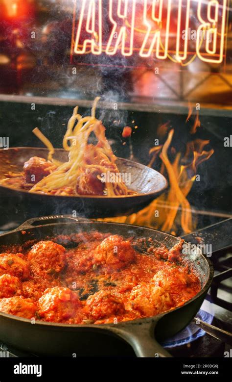 Kitchen In A Traditional Italian Trattoria Cooking Spaghetti And