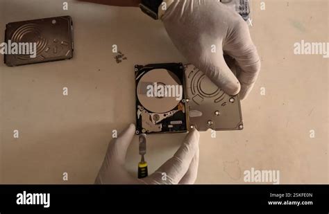 Scene From Above Showing The Technician Opening And Repairing The SSD Hard Disc Stock Video