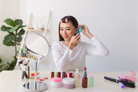 Hairstyle Tutorial Asian Woman Brushing Her Hair And Smiling