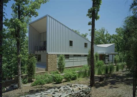 Bowtie House By Demx Architecture Has An Angular Metal Roof