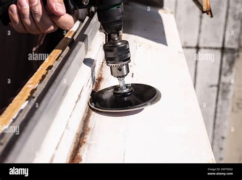 Machine During Sanding Rust From An Old Window Sill Stock Photo Alamy