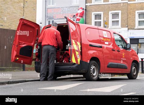 Santa Postman Open The Rear Doors Delivering And Distributing Christmas Presents To Local