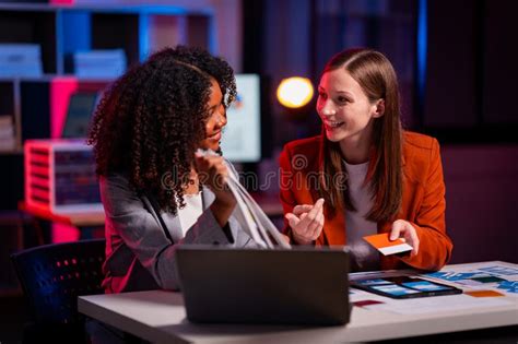 Two Female Ui Ux Designers Work Together To Talk About Designing Mobile App Interfaces On Both